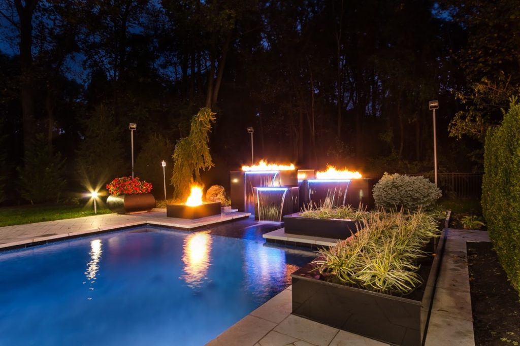 Sizzling Fire Features and Dramatic Lighting - Luxury Pools + Outdoor ...